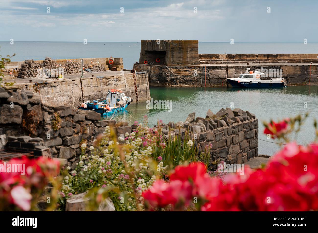 Two boats in the harbour at Craster during the summer, Northumberland ...
