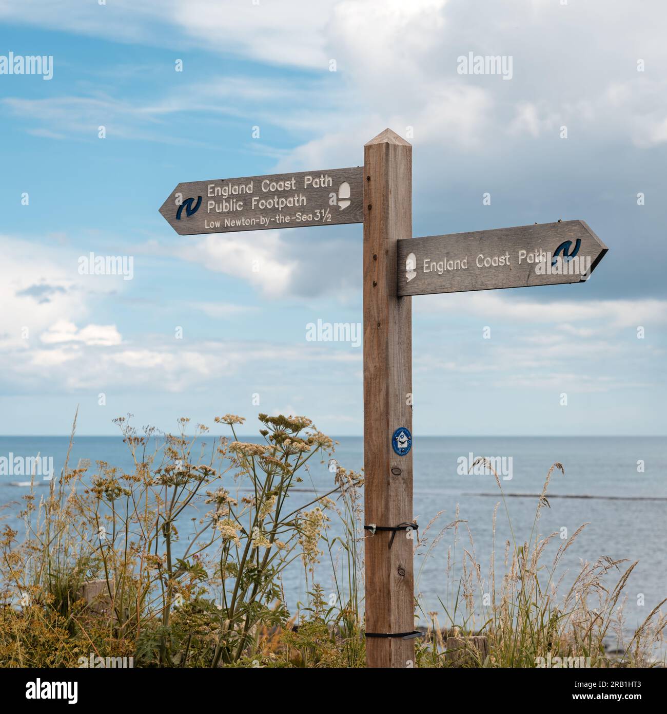 Coastal signpost from Craster to Dunstanburgh Castle, Northumberland ...