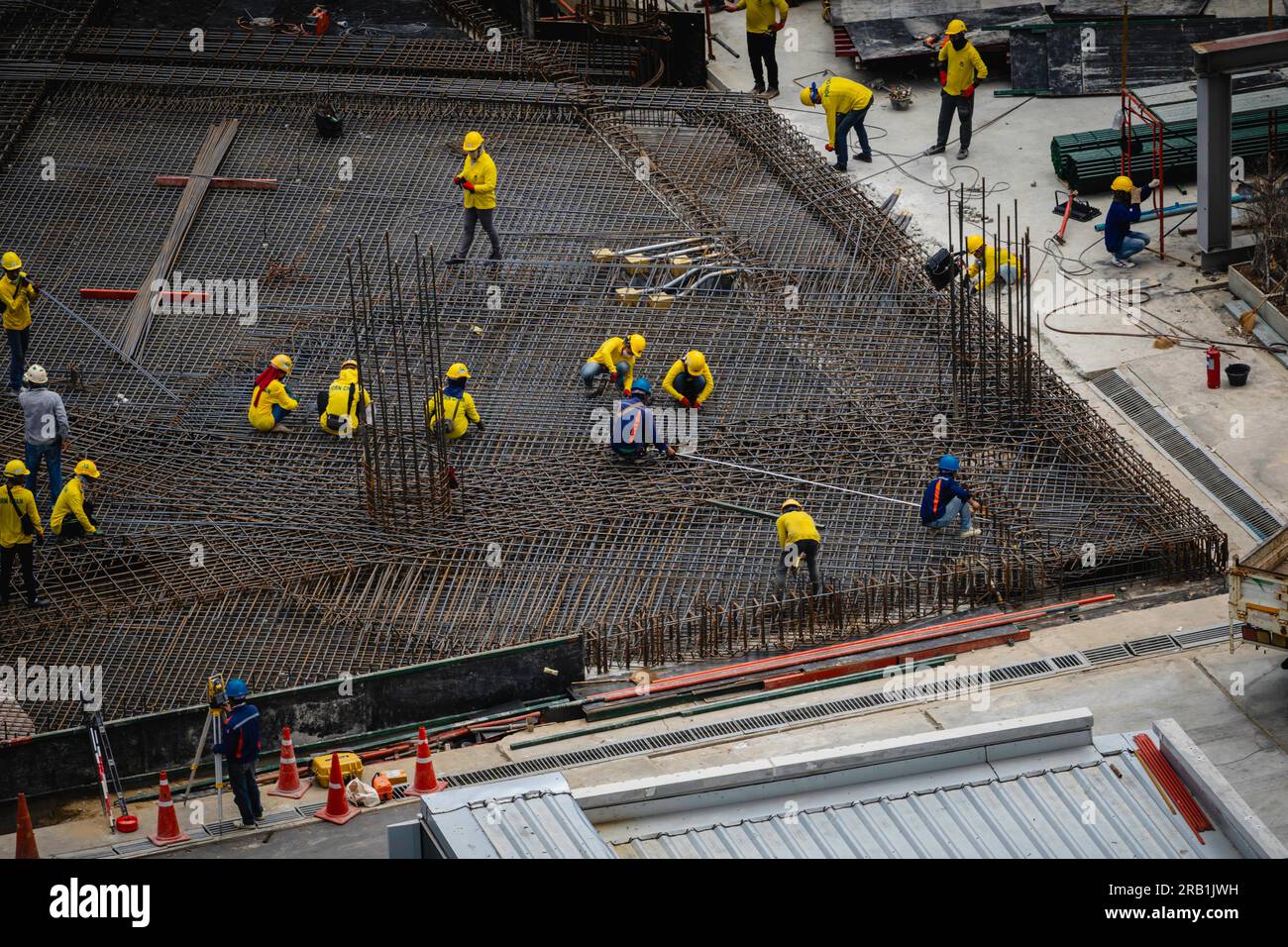 Construction workers are seen setting metal meshes at Cloud 11, a project under construction ...