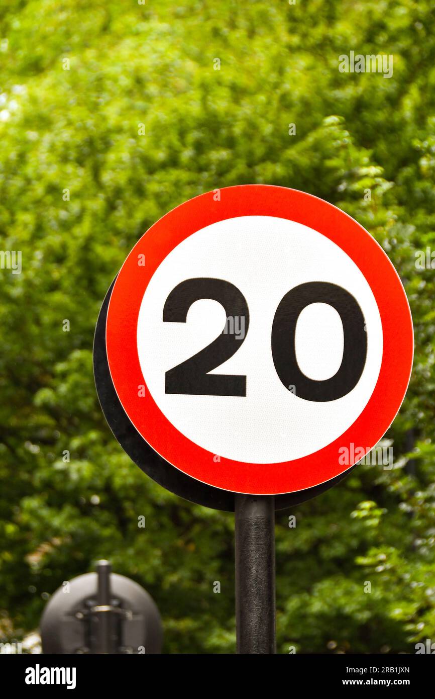 Road sign marking the start of a 20 mph speed limit zone in a ...
