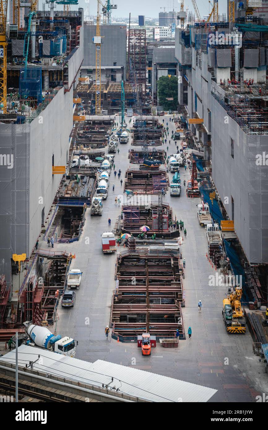 Construction workers are seen working on the site of 11 Cloud Project under construction, MQDC ...