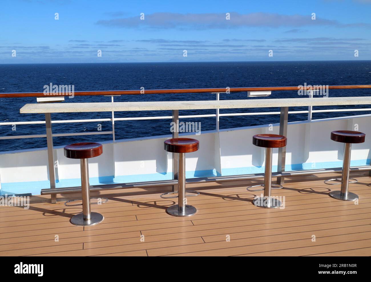 A row of bar stools with a sea view on the TUI Group cruise ship ...
