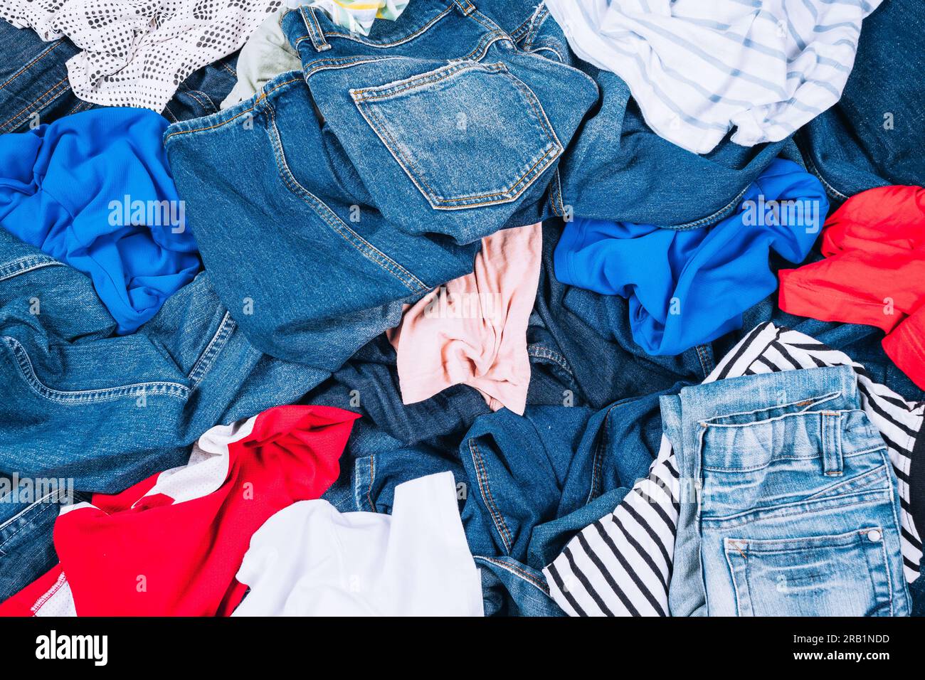 Pile of colorful clothes. Abstract background of used clothes for ...