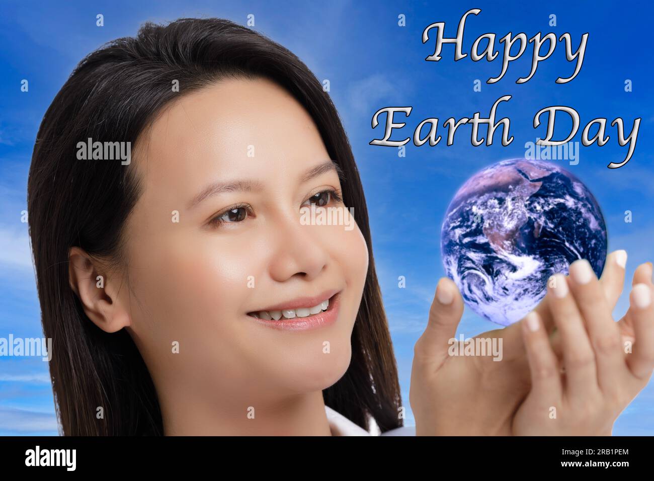Asian woman celebrating Earth Day isolated on a blue sky background ...