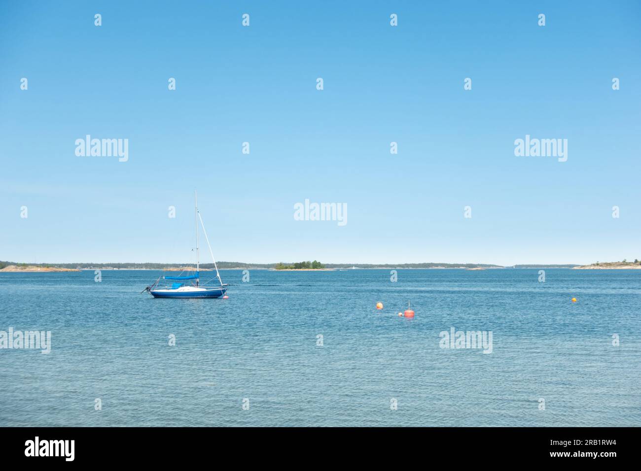 Sailboat anchored in crystal clear hi-res stock photography and images ...