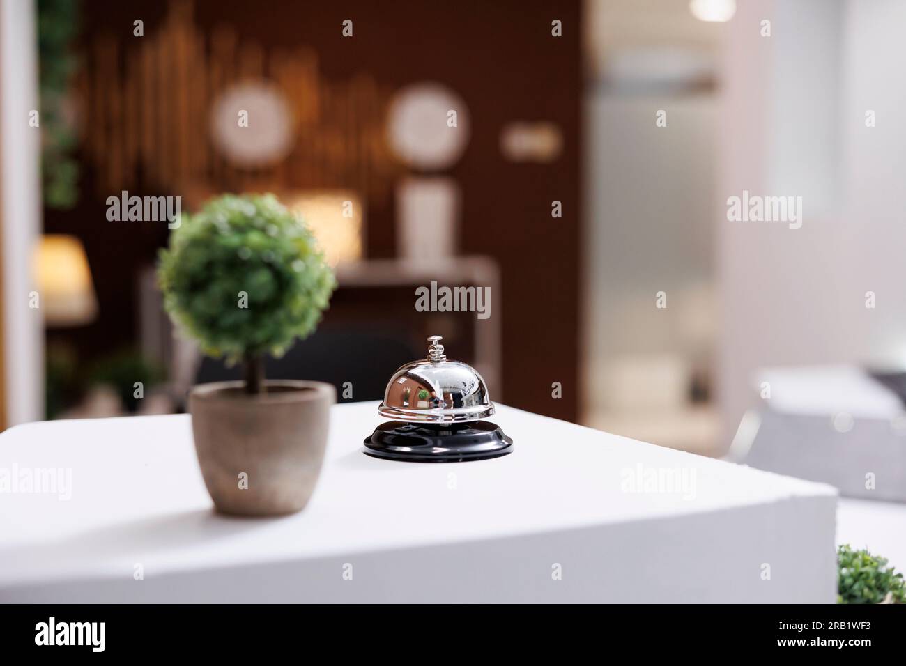 Service bell on reception desk at hotel, used by guests to ring and ...