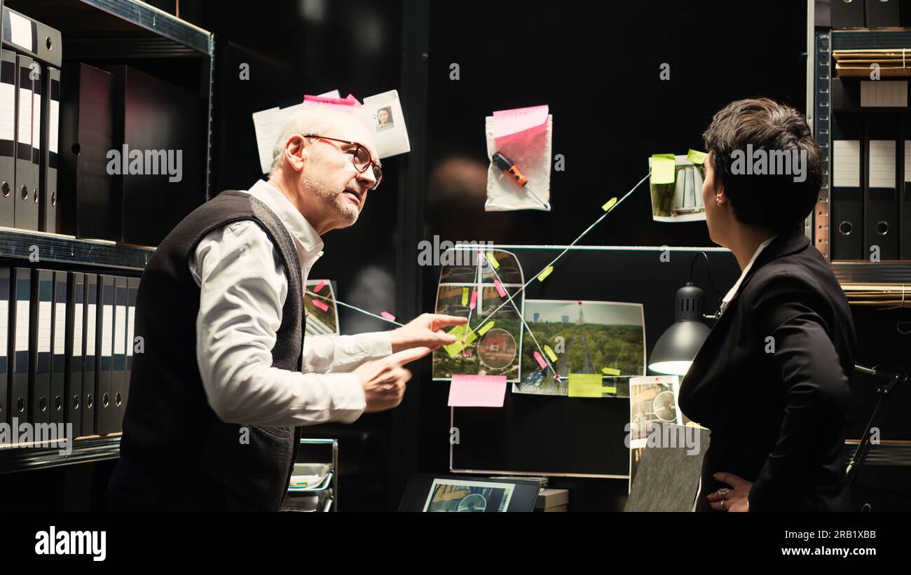 Experts connecting clues on board, analyzing forensic evidence and ...