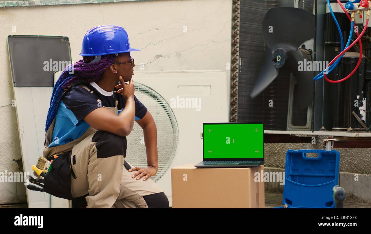 African american specialist ordering new internal parts on chroma key ...
