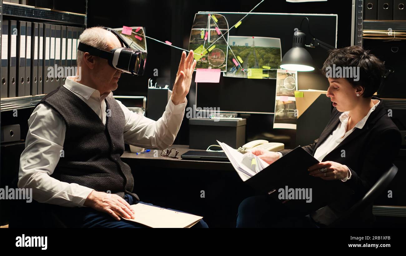 Senior agent using vr glasses to reenact crime scene, conducting ...