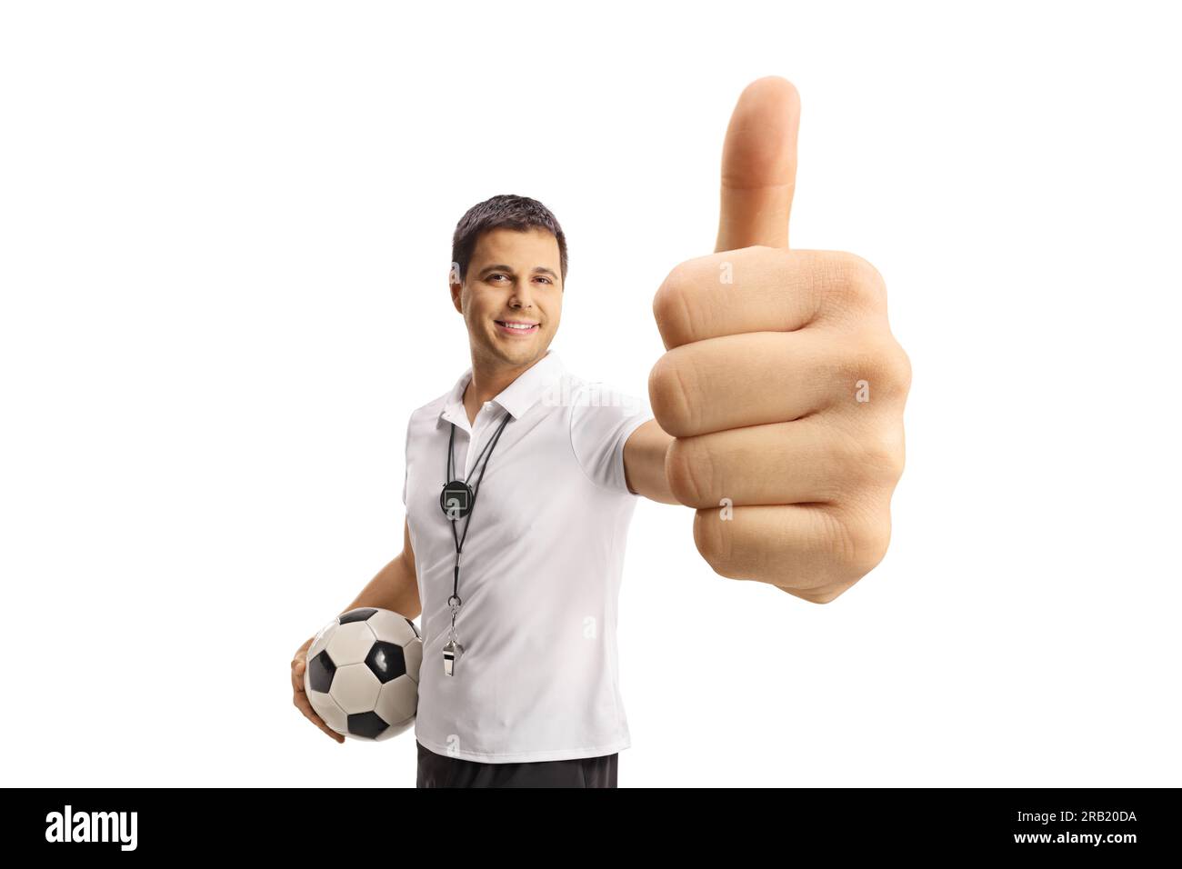 Soccer coach holding a ball and showing thumbs up isolated on white ...