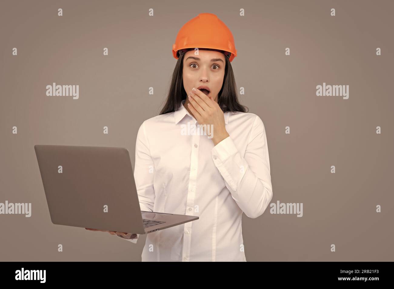 Surprised shocked excited business woman with laptop computer, portrait ...