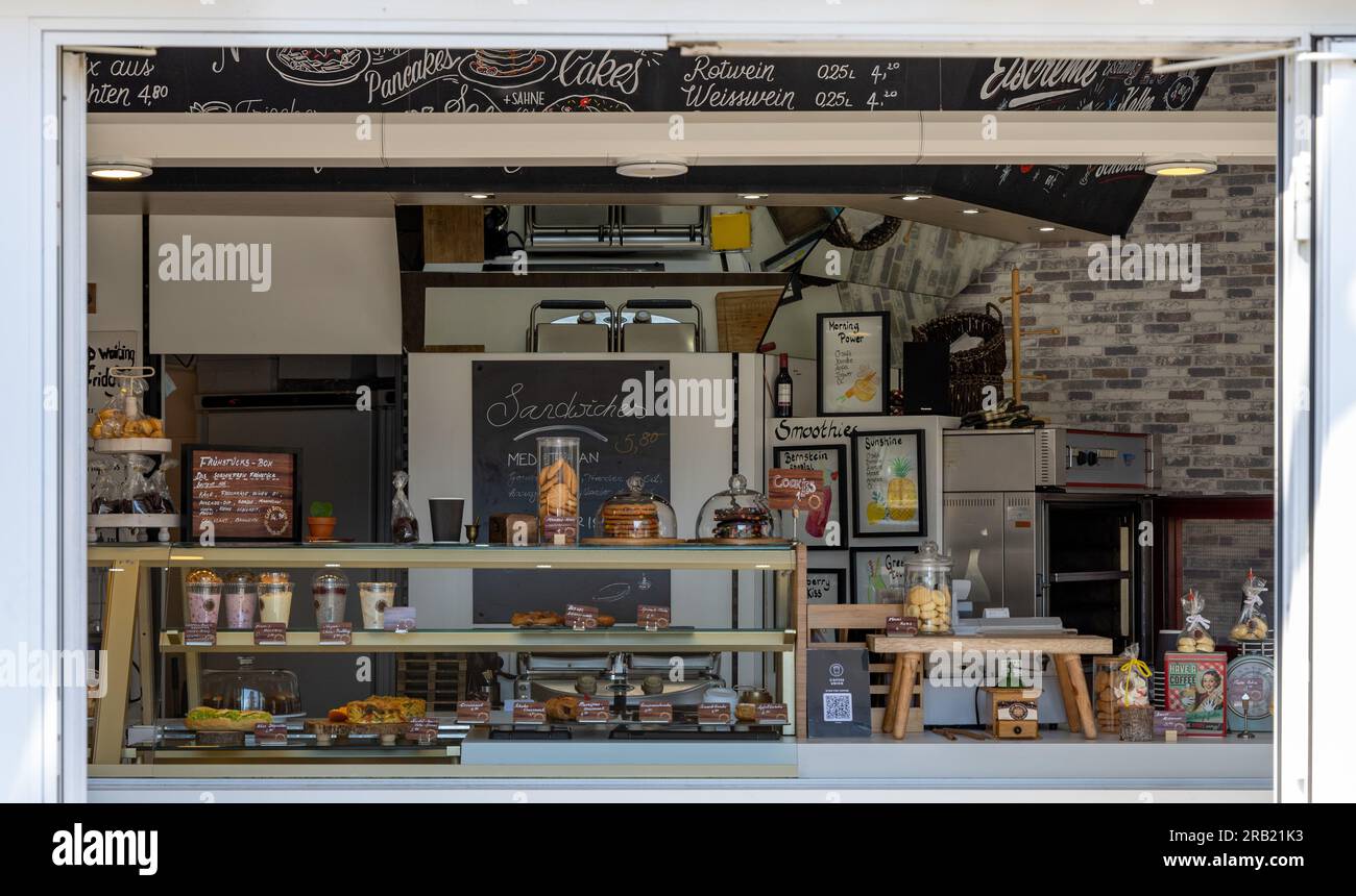 View on a counter of an Italian style cafe through the open doors ...