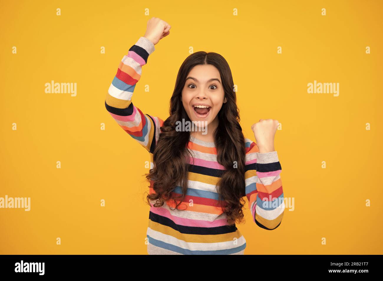 Amazed teenager. Child girl rejoicing, say yes, looking happy and ...