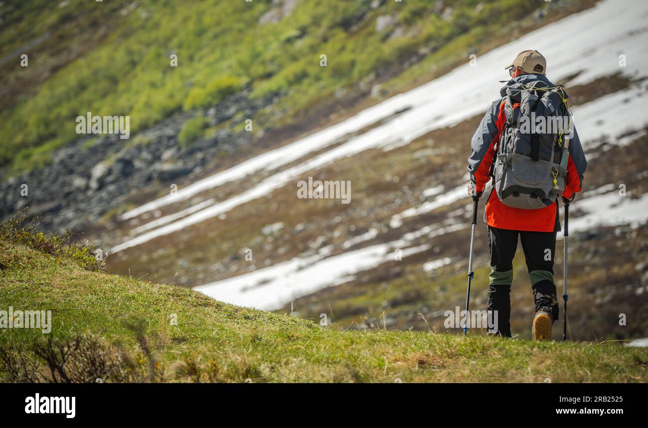 Back View of Professionally Equipped Hiker with Backpack and Trekking ...