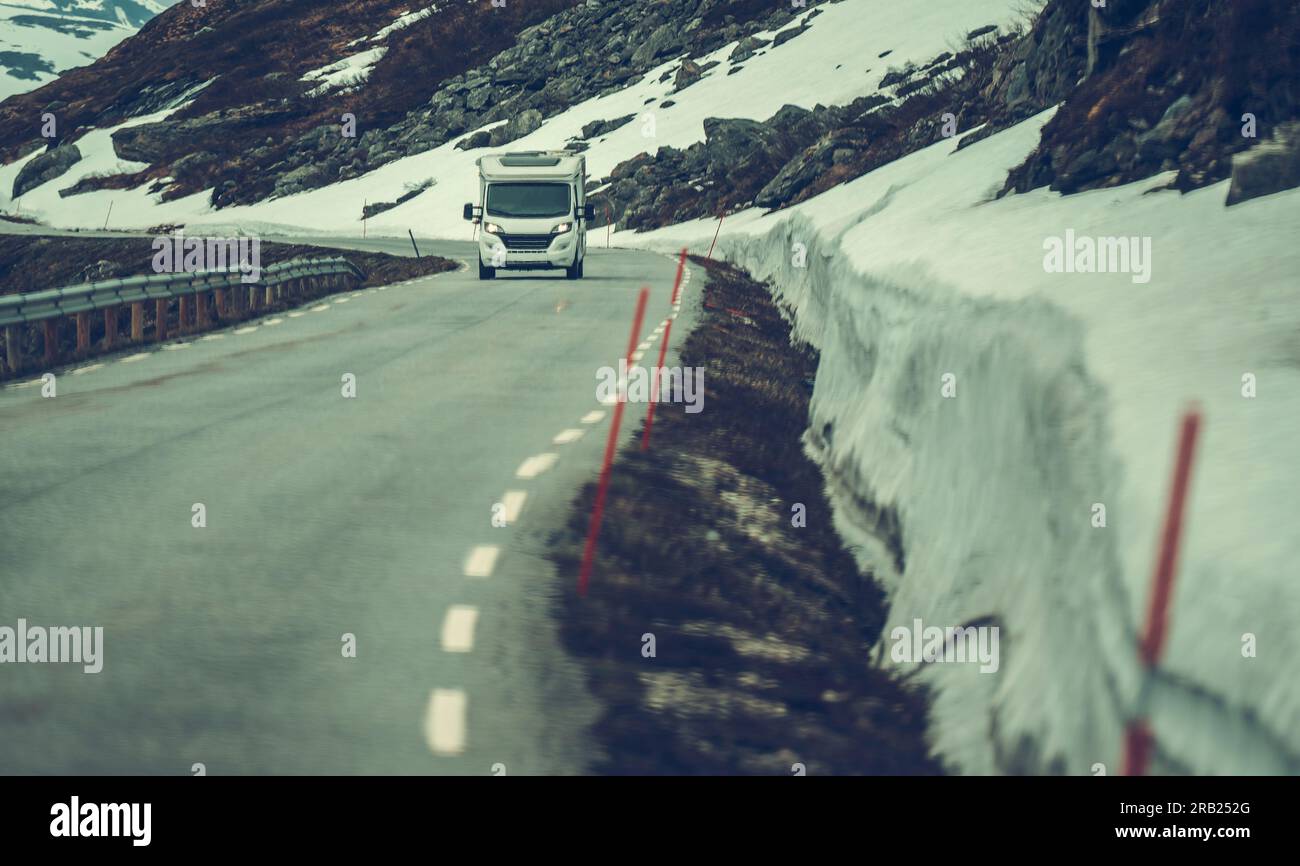 Front View of Modern White Camper Van Driving Down the Road in Snowy ...