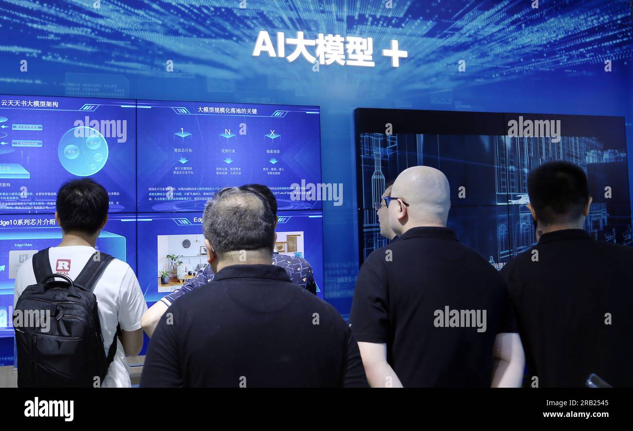 SHANGHAI, CHINA - JULY 6, 2023 - Visitors look at the AI Grand model + at the 2023 WAIC in ...