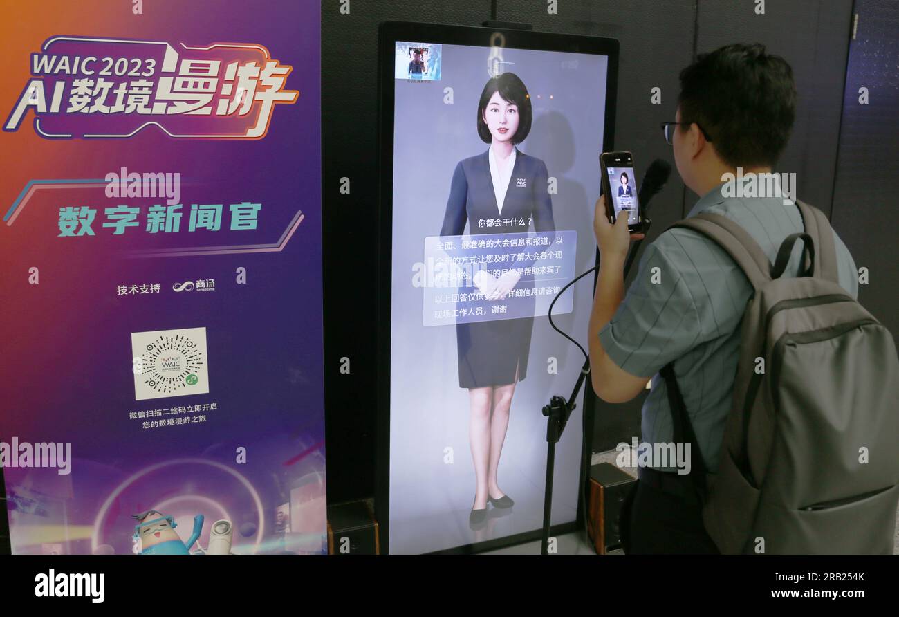 SHANGHAI, CHINA - JULY 6, 2023 - A viewer takes a photo of a digital news officer produced by ...
