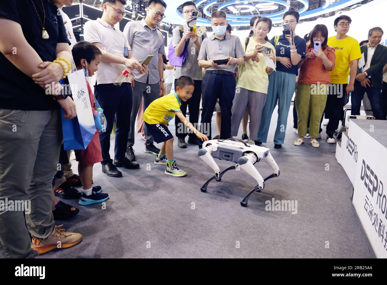 Shanghai, China. 07th July, 2023. SHANGHAI, CHINA - JULY 6, 2023 - A child interacts with the ...
