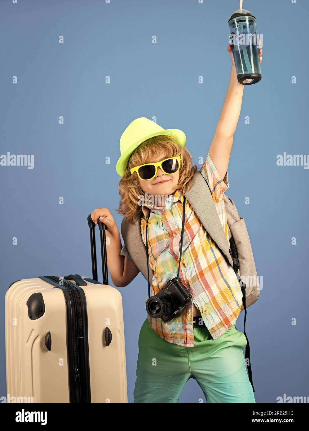 Traveler tourist kid boy 7-8 years old on isolated studio background ...