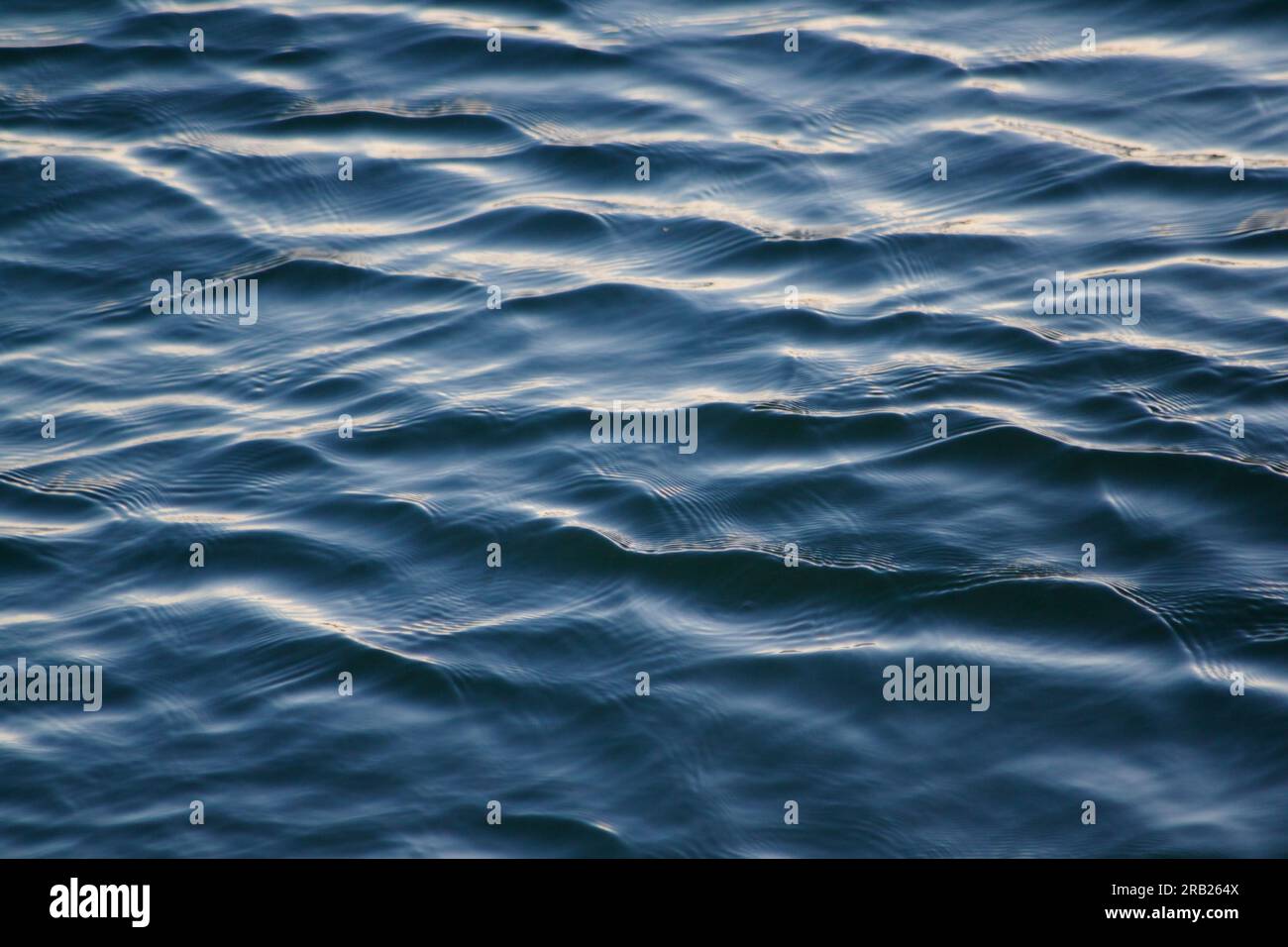 There are ripples of blue ocean waves Stock Photo - Alamy