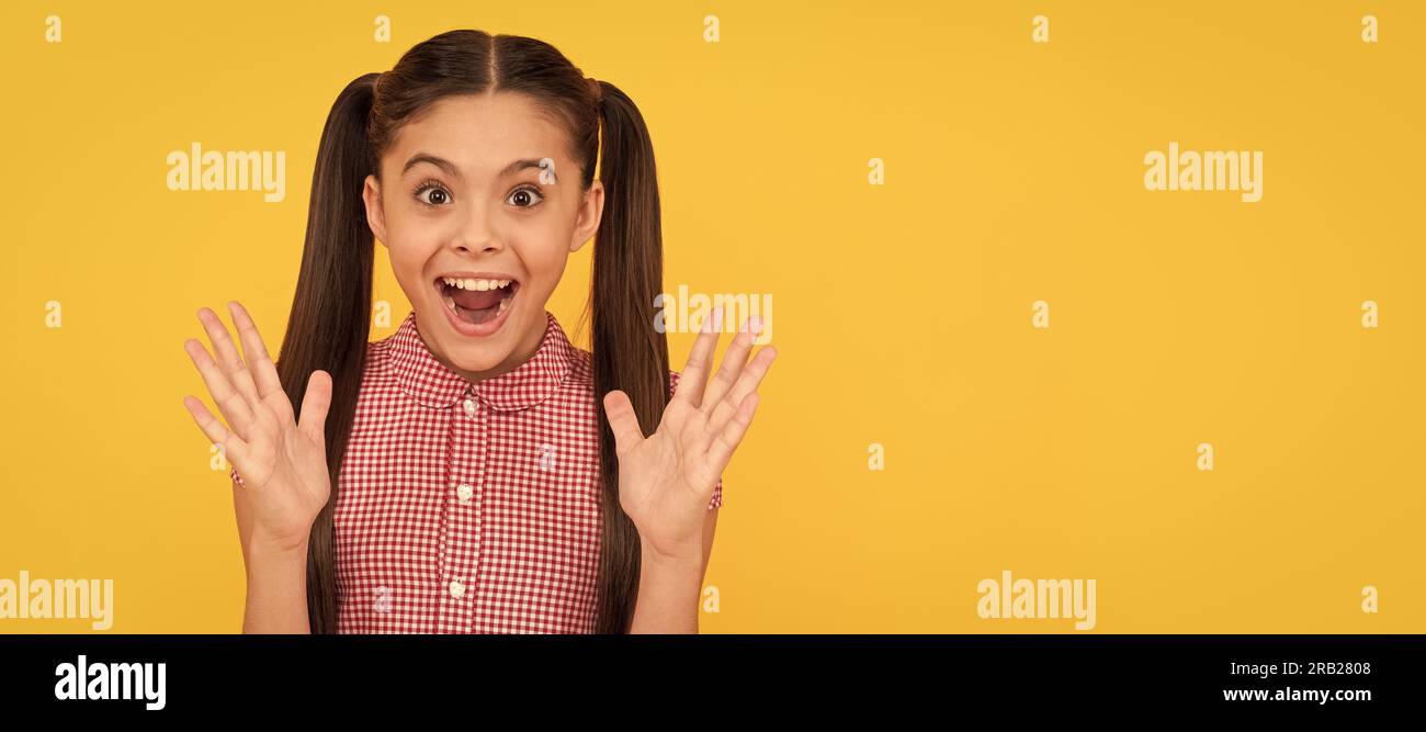 Pleasantly surprised happy kid keep mouth open yellow background ...