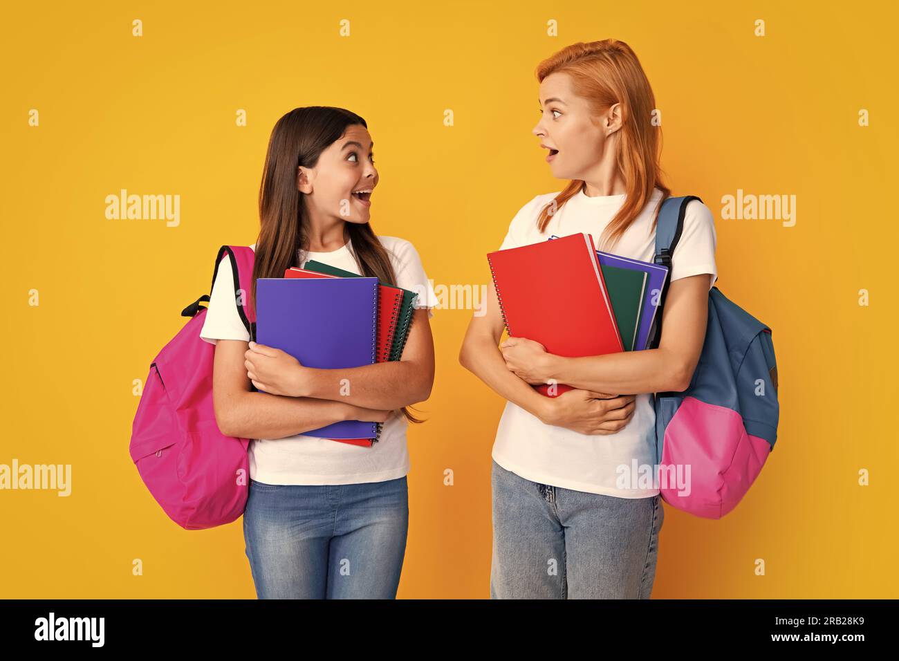 School, learning and education concept. Mother and daughter schoolgirls ...