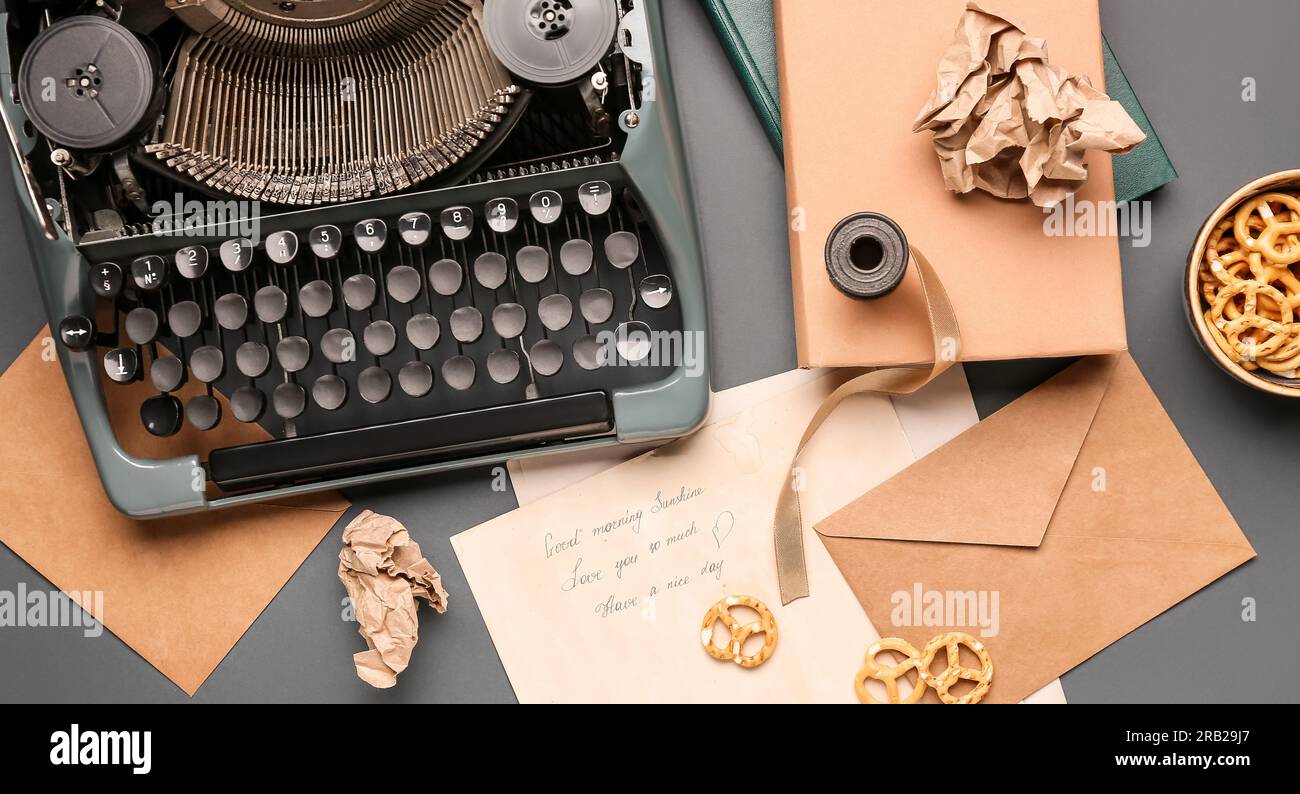 Vintage typewriter, letters, envelope, crumpled paper, books and ...