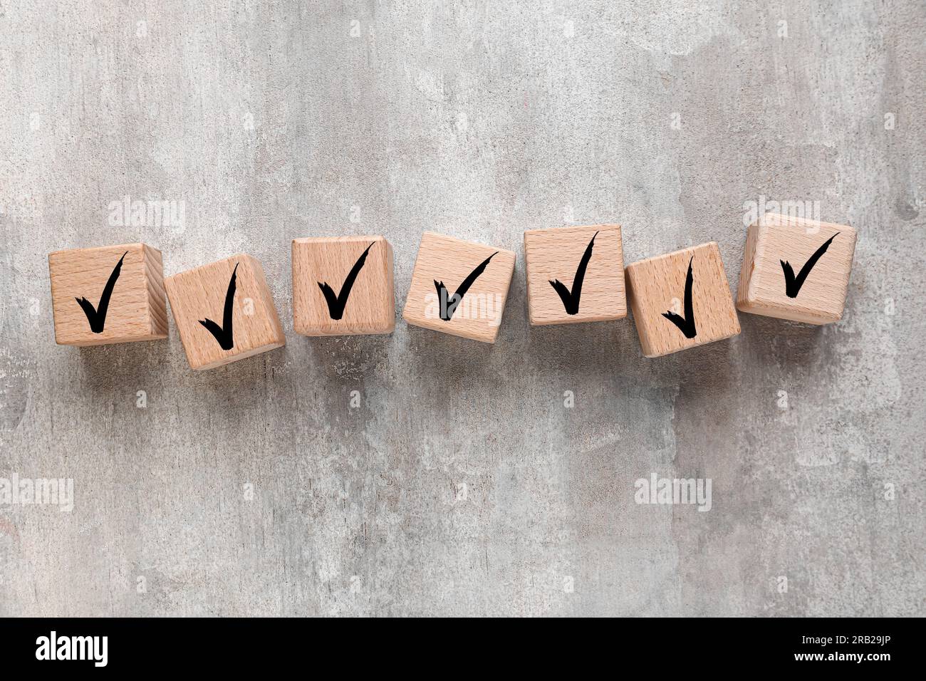 Wooden cubes with check marks on grunge background Stock Photo - Alamy