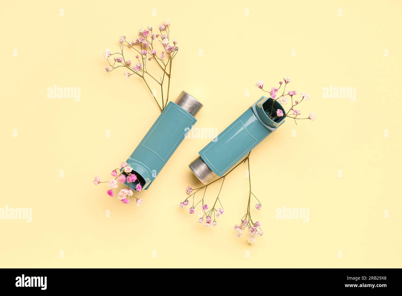 Asthma inhalers with flowers on yellow background Stock Photo - Alamy