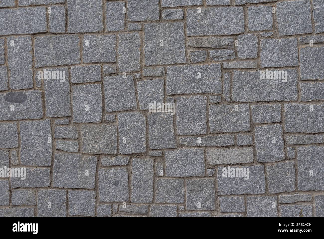 A wall of granite stones of different sizes. vector stone texture ...