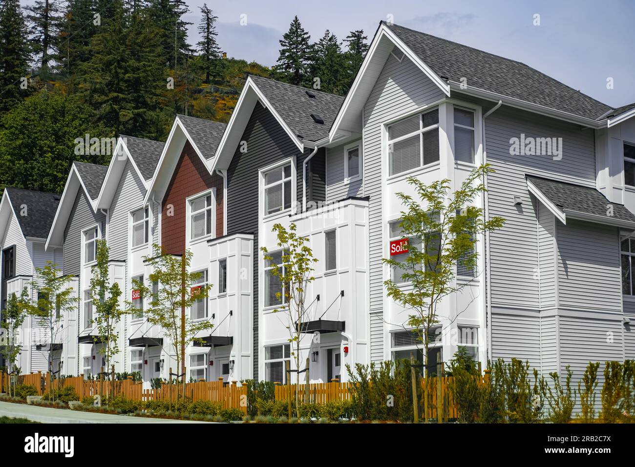Facade of new residential townhouses. Modern buildings in Canada. Real ...