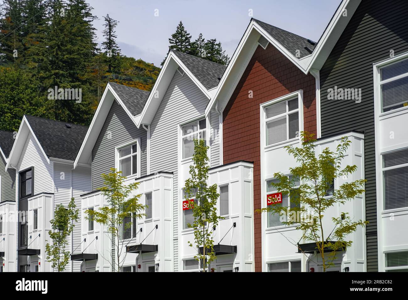 Facade of new residential townhouses. Modern buildings in Canada. Real ...