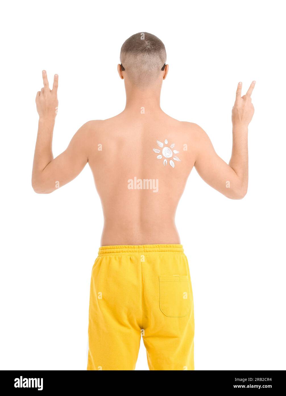 Young man with sun made of protection cream on his body showing victory ...