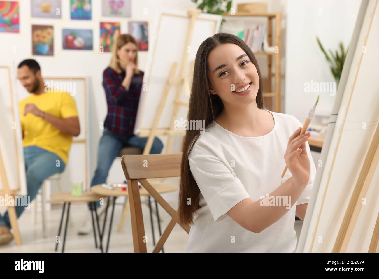 Group of students attending painting class in studio. Creative hobby ...