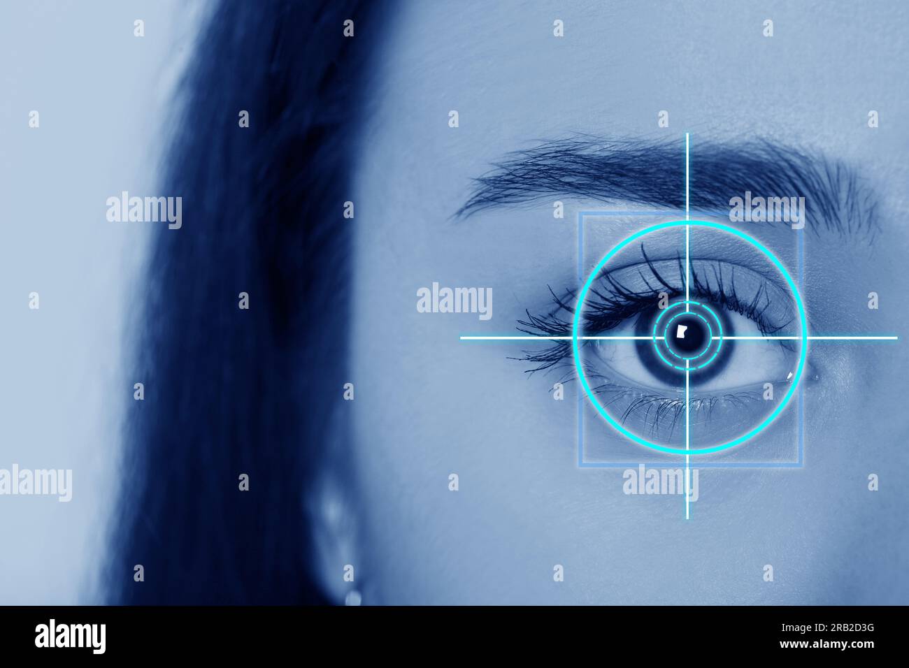 Vision test. Laser reticle focused on woman's eye, closeup. Light blue ...