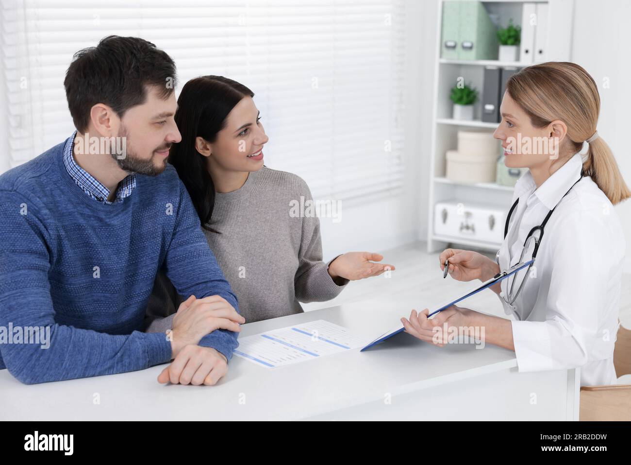 Couple having appointment with fertility doctor in clinic. Patient ...