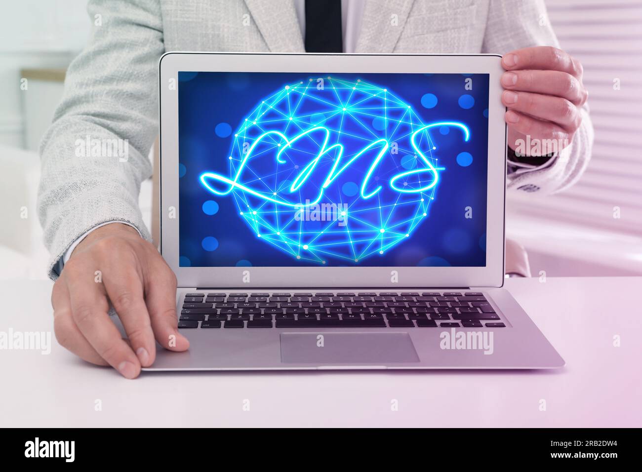 Learning management system. Man showing modern laptop at table, closeup ...