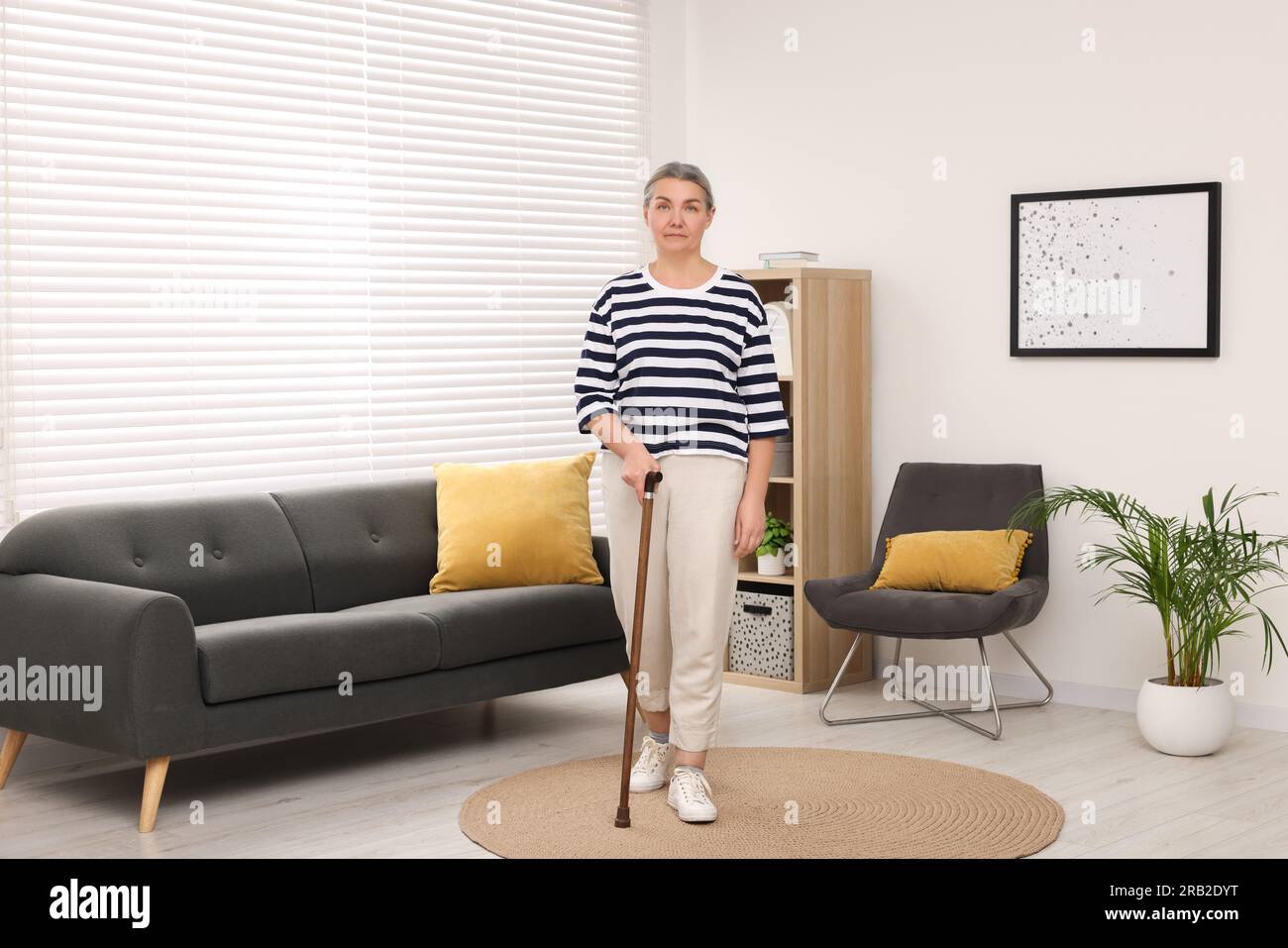 Senior woman with cane hi-res stock photography and images - Alamy