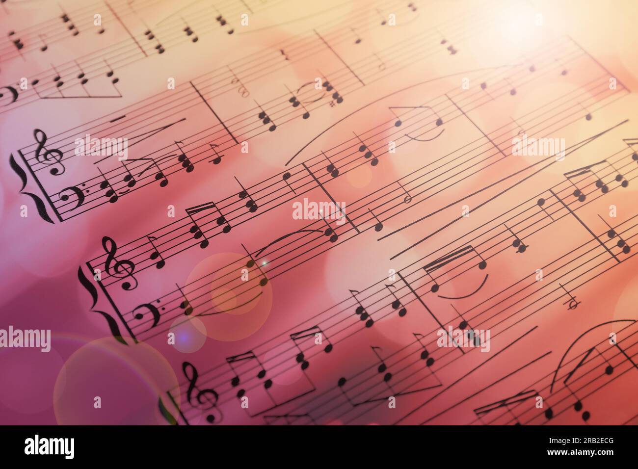 Sheet with music notes as background, closeup. Bokeh and color tone ...
