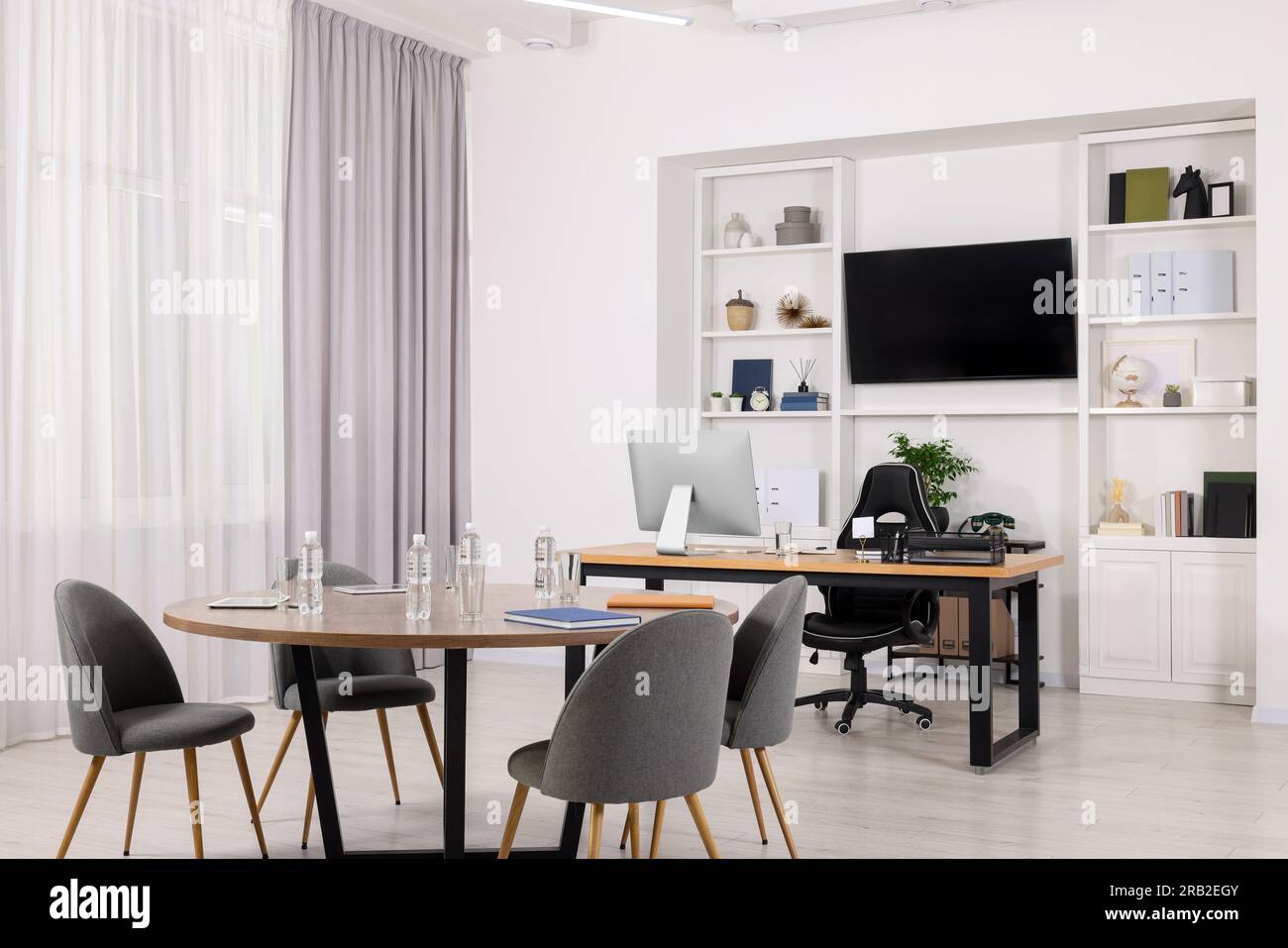 Stylish office with comfortable furniture and tv zone. Interior design ...