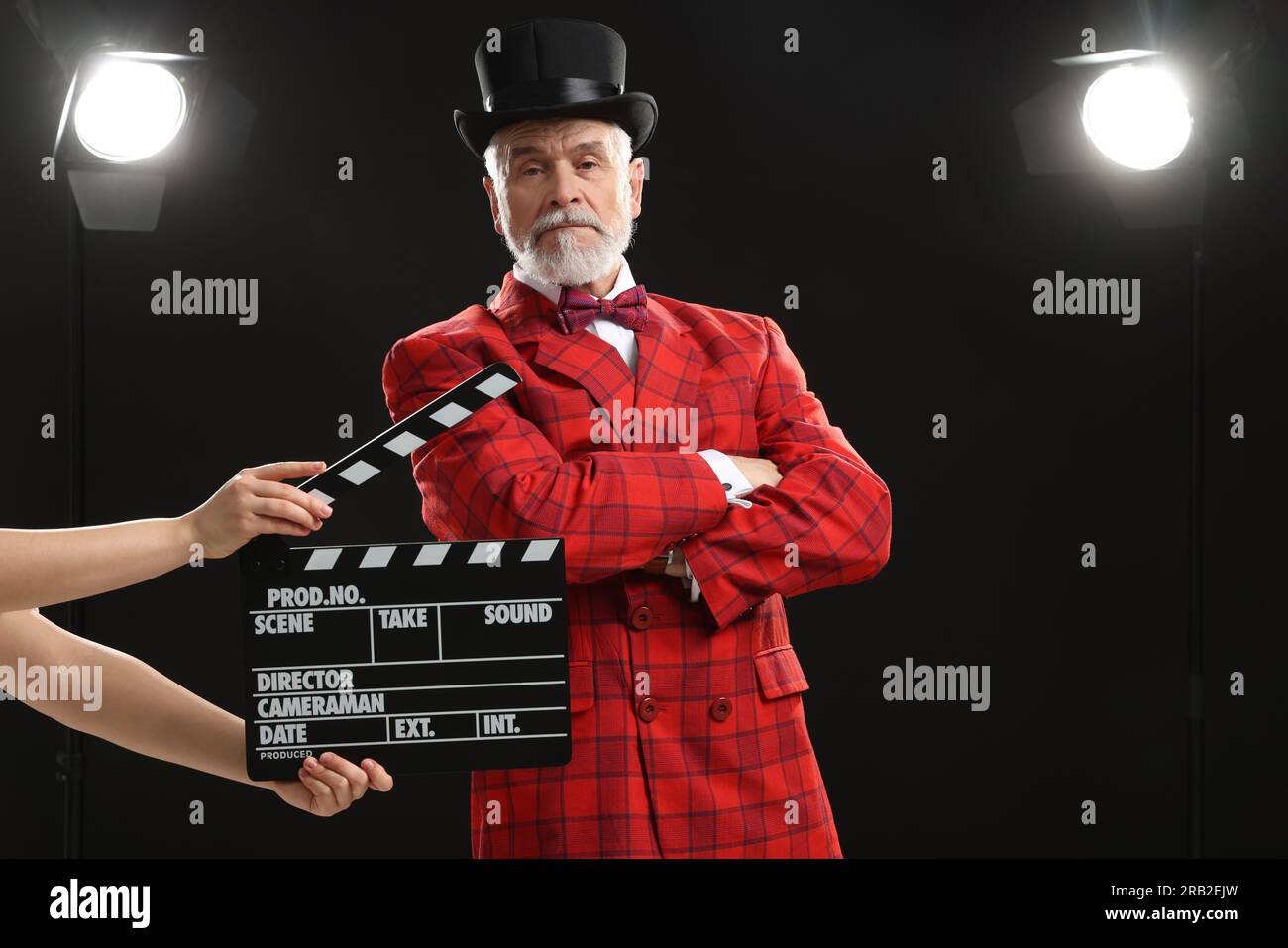 Senior actor performing role while second assistant camera holding ...