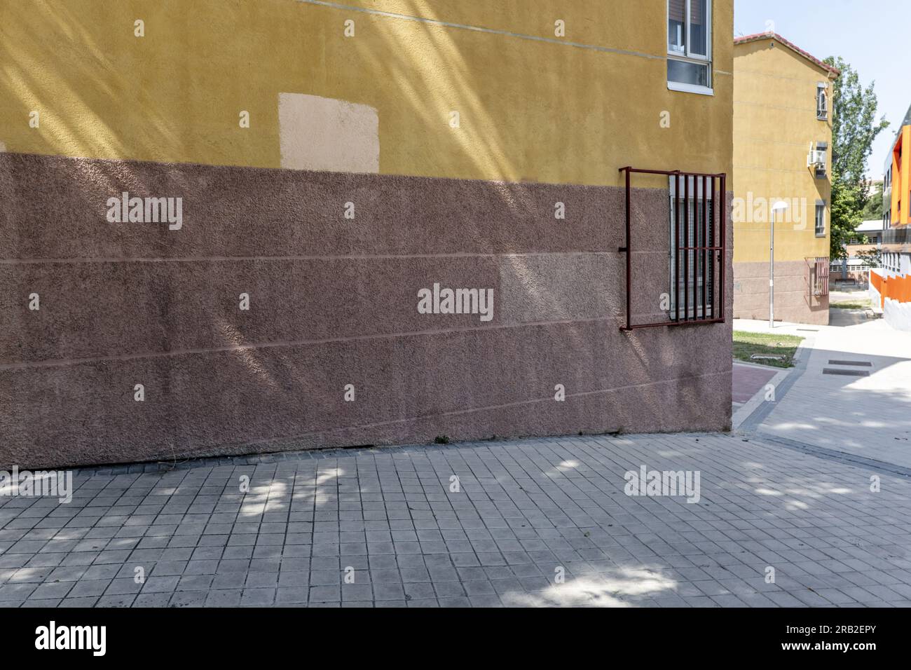 A wall without graffiti on a building in a modest neighborhood of the ...