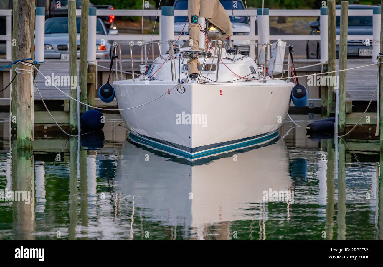 white sail boat in a slip in sag harbor, ny Stock Photo - Alamy