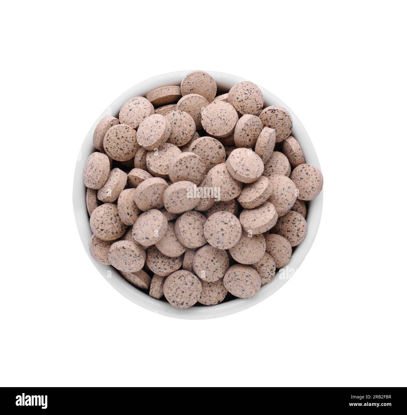 Brewer's yeast tablets in bowl isolated on white, top view Stock Photo ...