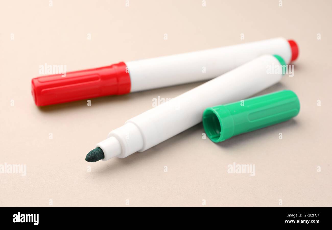 Bright color markers on beige background. Office stationery Stock Photo ...