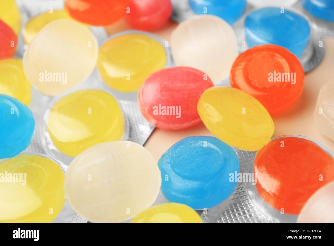 Blisters and many colorful cough drops as background, closeup Stock ...