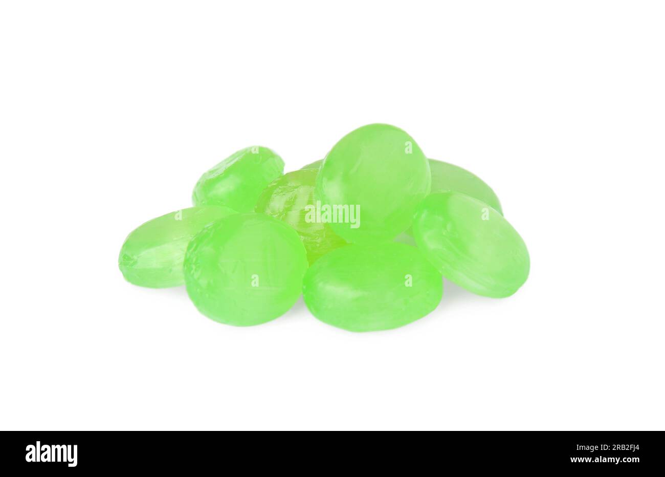 Many light green cough drops on white background Stock Photo - Alamy