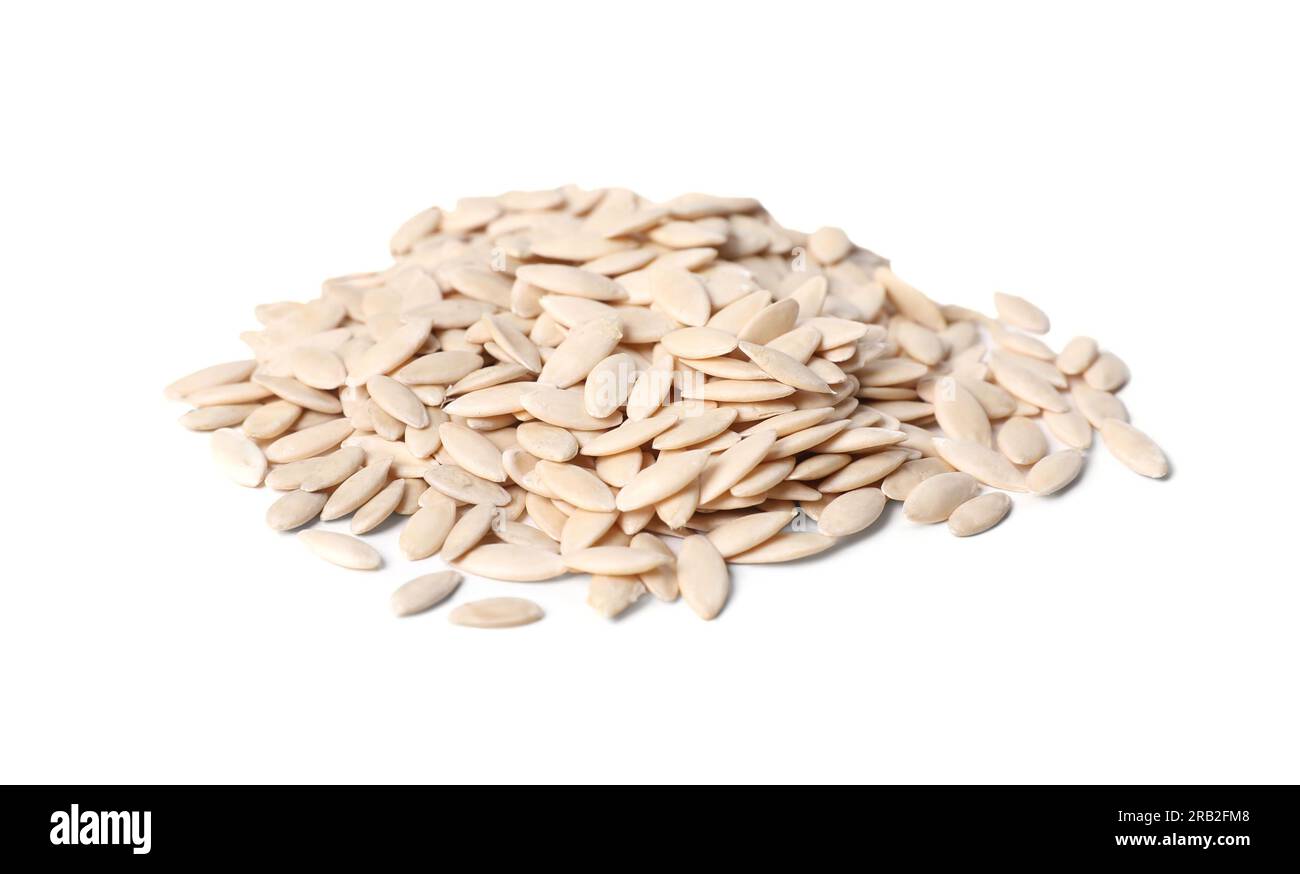 Pile of cucumber seeds on white background Stock Photo - Alamy