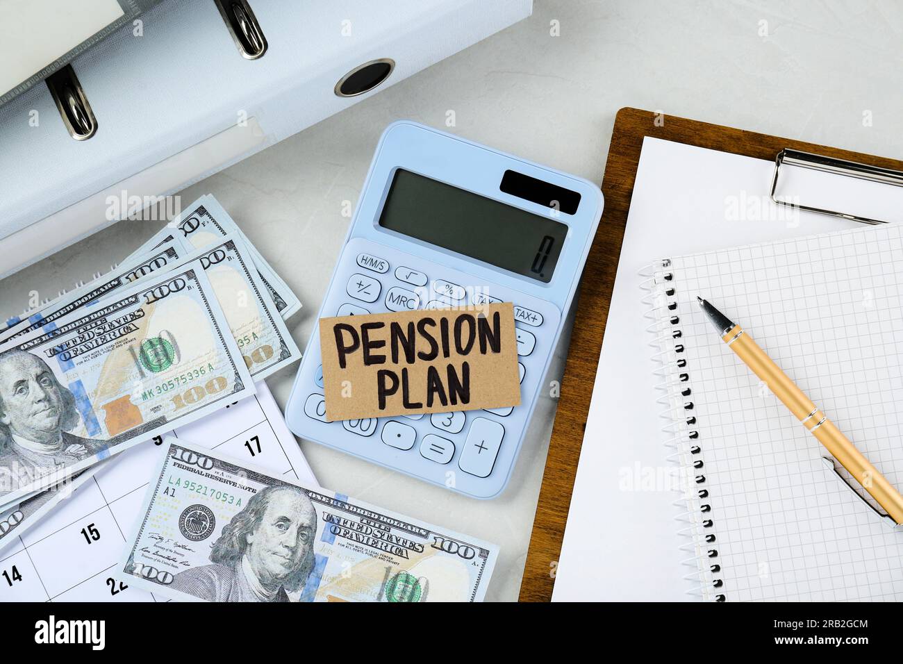 Card with phrase Pension Plan, dollar banknotes, calculator and ...