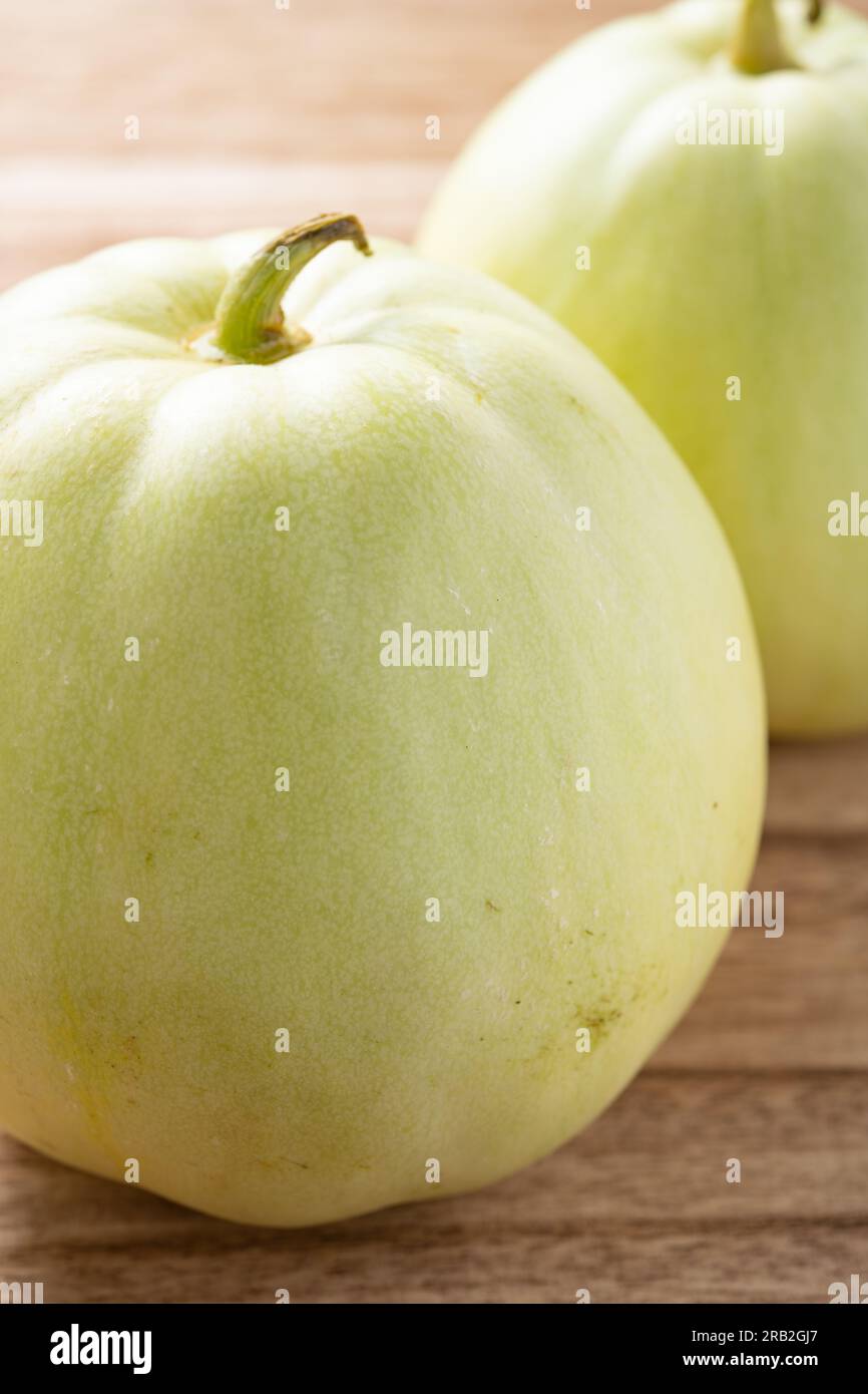 angle view muskmelons on a wood background at vertical composition ...